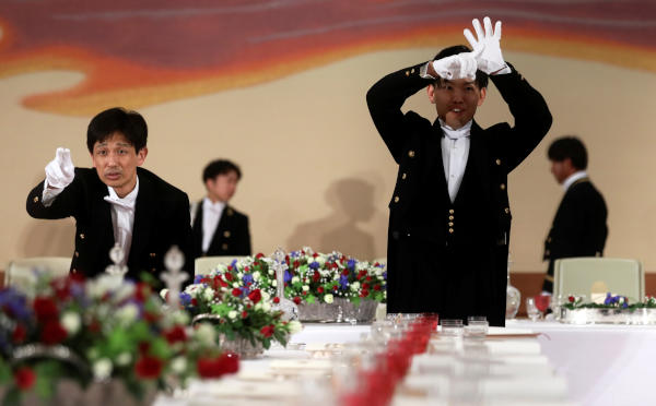 Attendants prepare tables ahead of a state banquet with US President ...