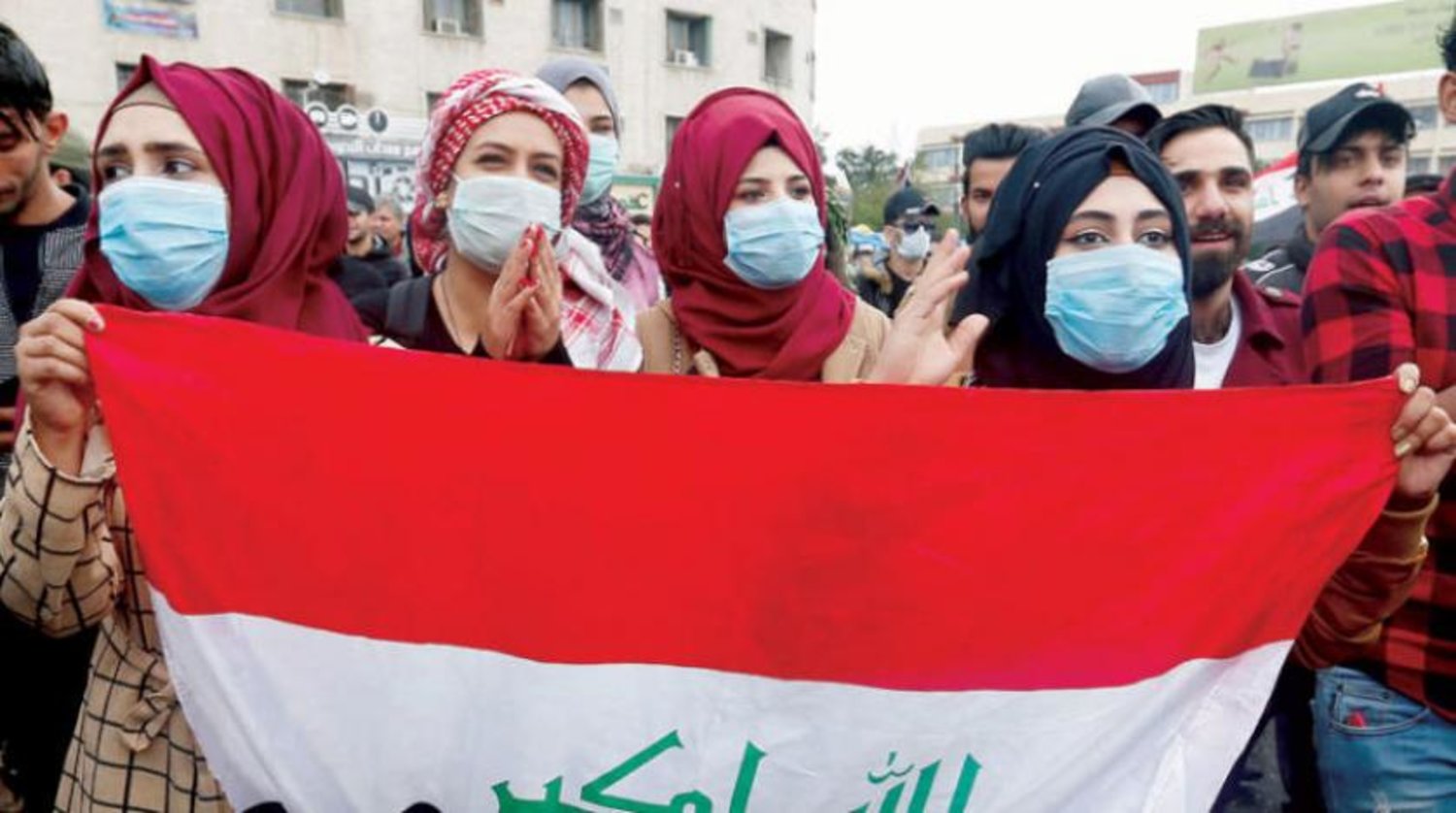 Wearing Masks, Iraqis Protest against the Parliament