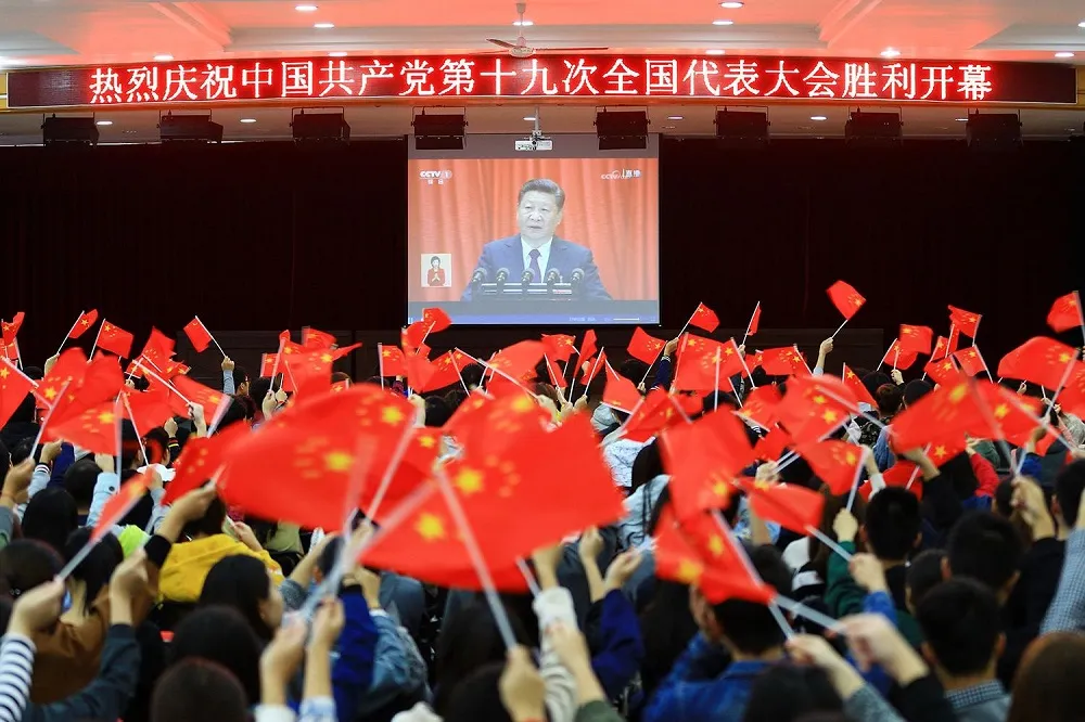 China’s Communist Party Elevates Xi to Mao’s Status