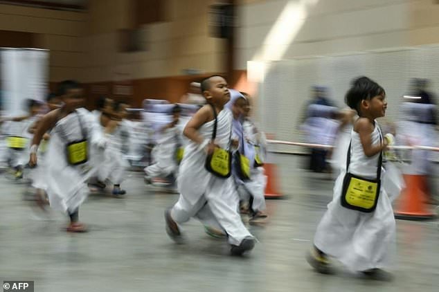 Malaysian Children in Practice Run for Muslim Hajj